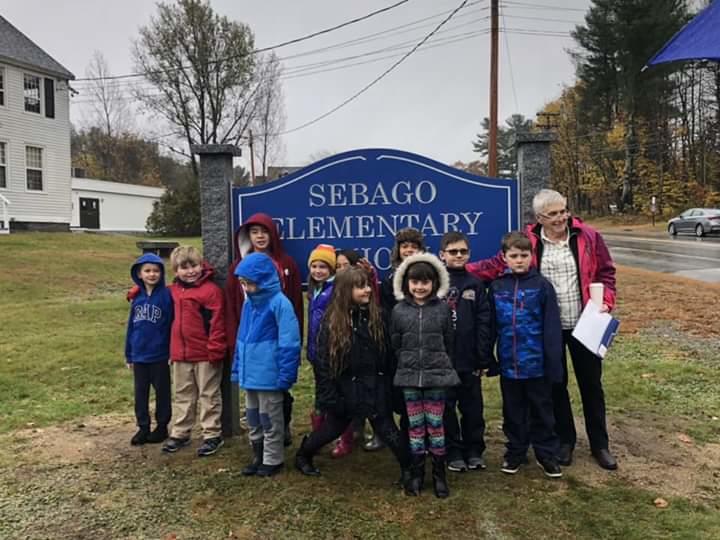 Sebago school celebrates new start with new sign